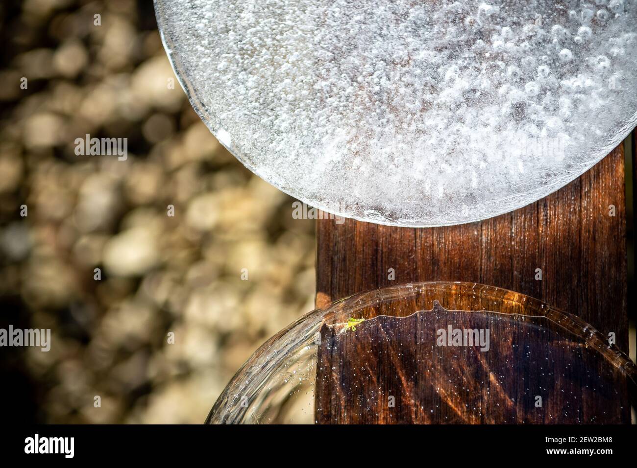 Two ice circles on table with blurred stone background Stock Photo - Alamy
