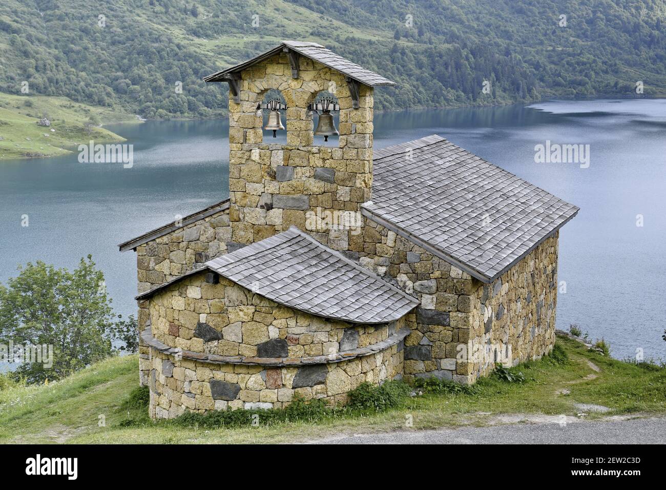 France, Haute Savoie, chapel at the edge of the Roselend dam lake Stock ...