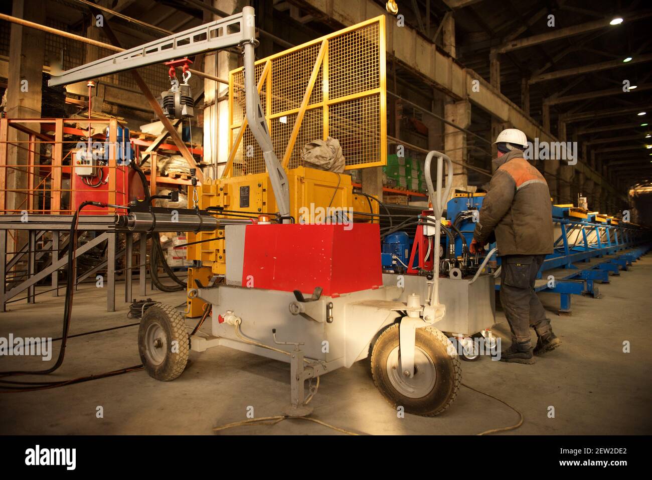 Ukrainian workers at the factory of reinforced concrete products ...