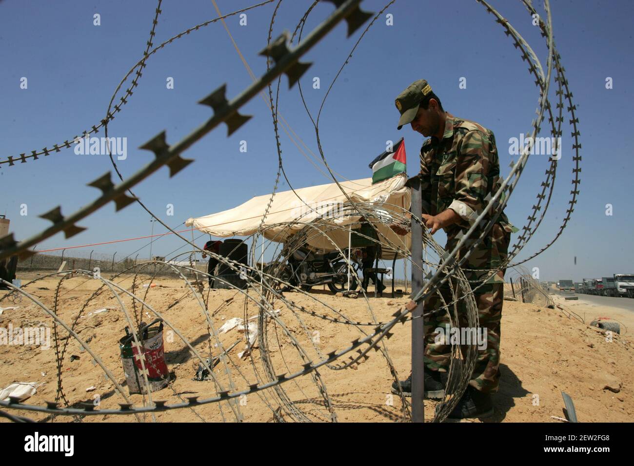 A member of the Palestinian security forces loyal to Hamas installs ...