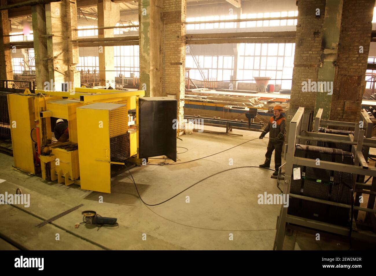 Ukrainian workers at the factory of reinforced concrete products ...