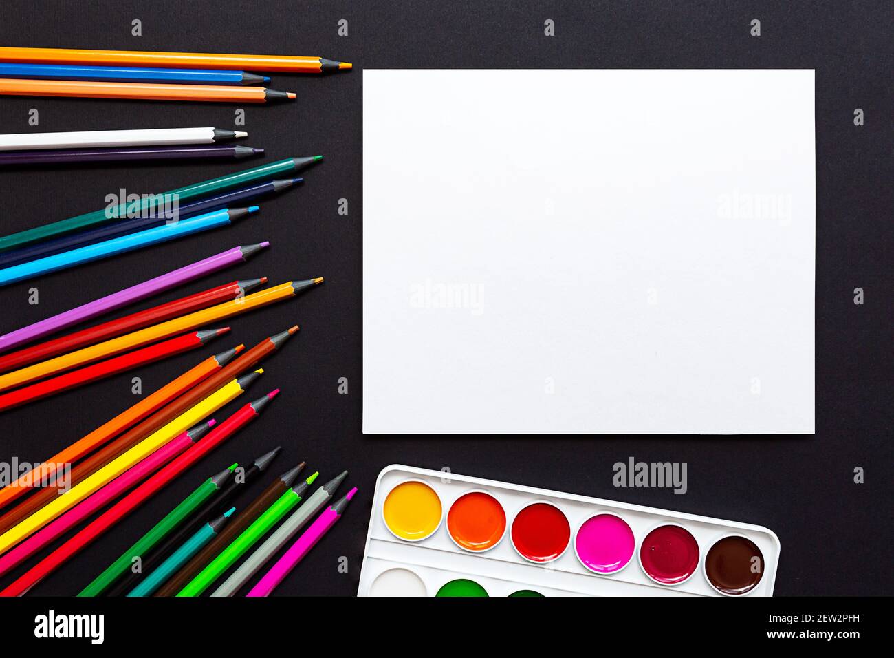 Blank sheet of paper, colored pencils and paints. Mock up, flat lay ...