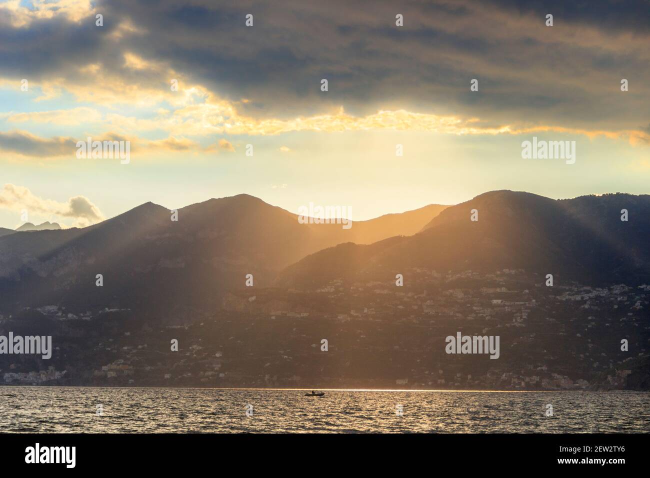 Sunset on the Amalfi Coast in Italy (Campania). Ray of sunlight ...
