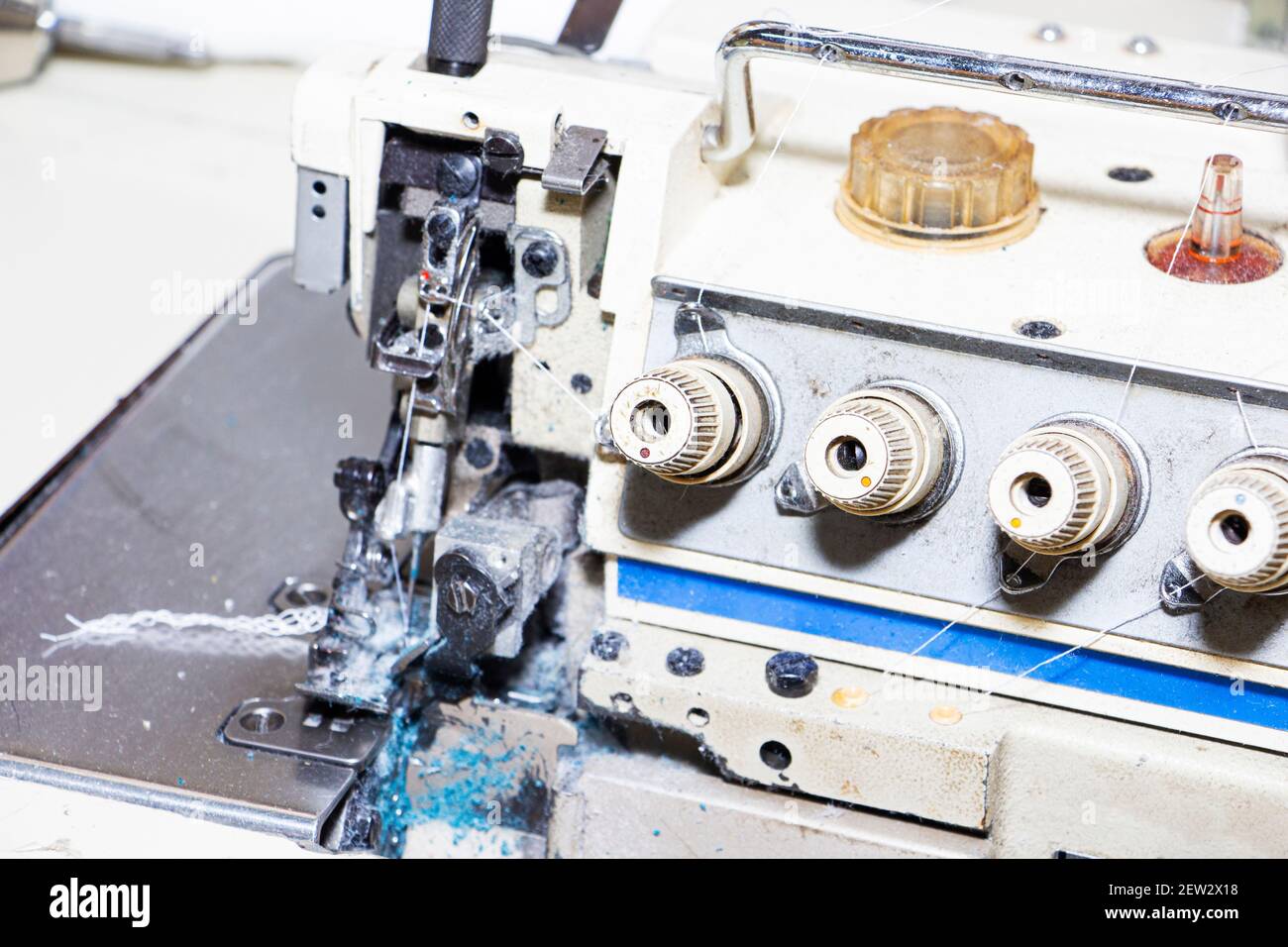 Four-thread industrial sewing machine overlock. An overlock is a type ...