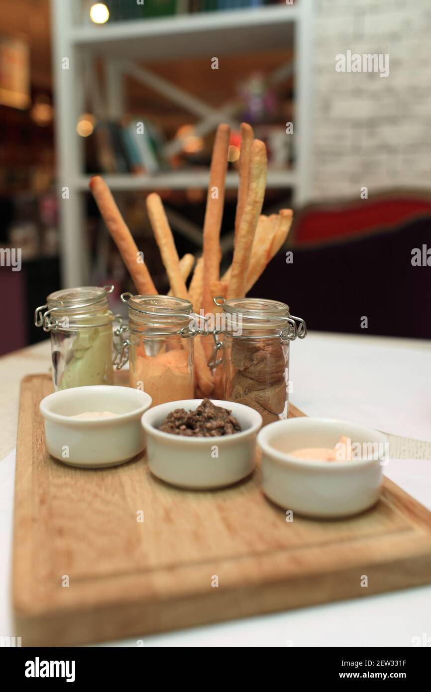 Set of pates in the containers on a tray Stock Photo - Alamy