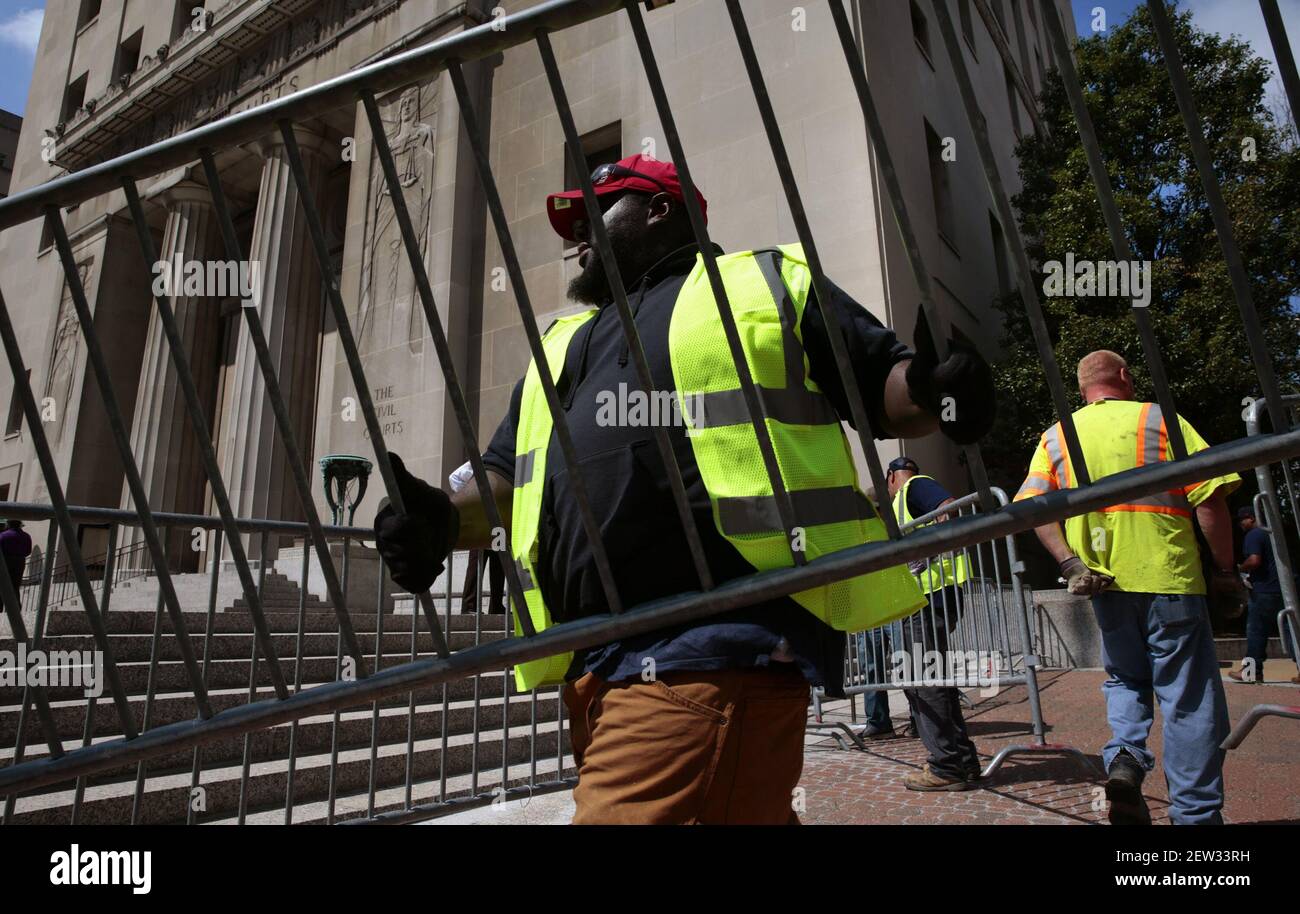 Rodney McMahan, lead utility worker with St. Louis city, carries a ...