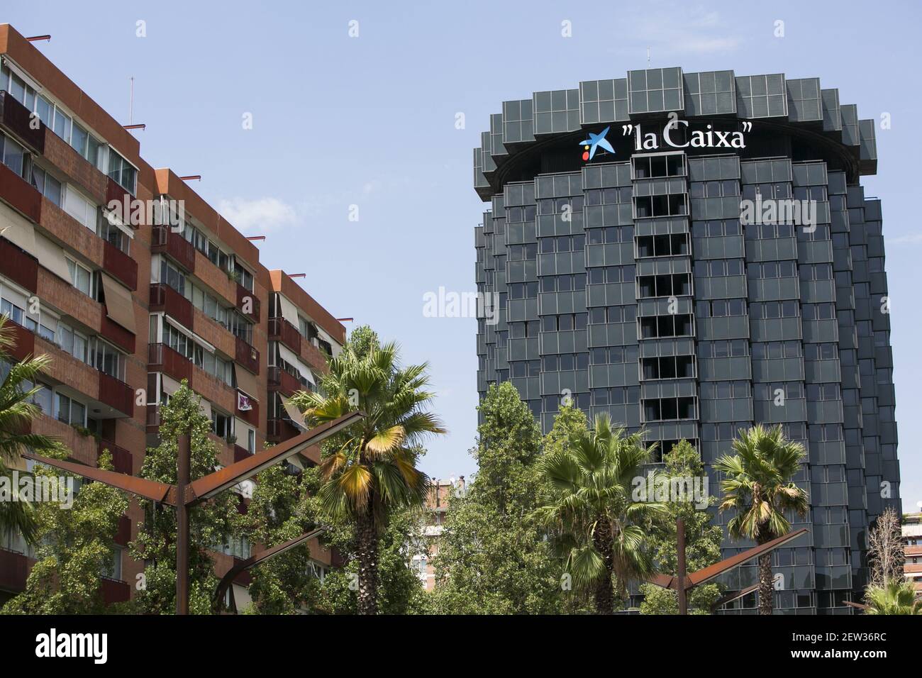 A logo sign outside of the headquarters of the La Caixa group and Caixa ...