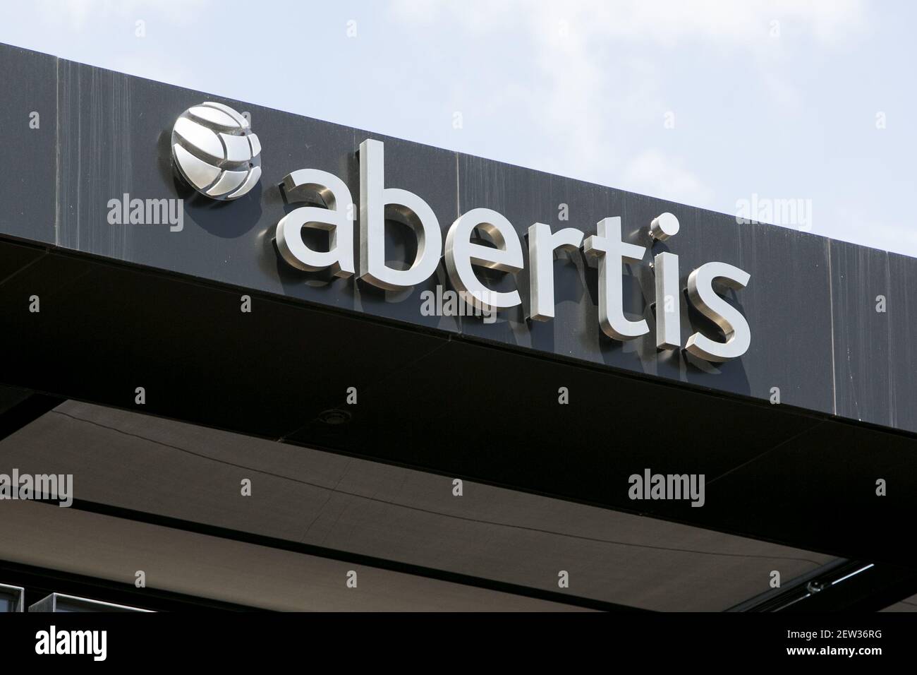A logo sign outside of the headquarters of Abertis Infraestructuras in ...