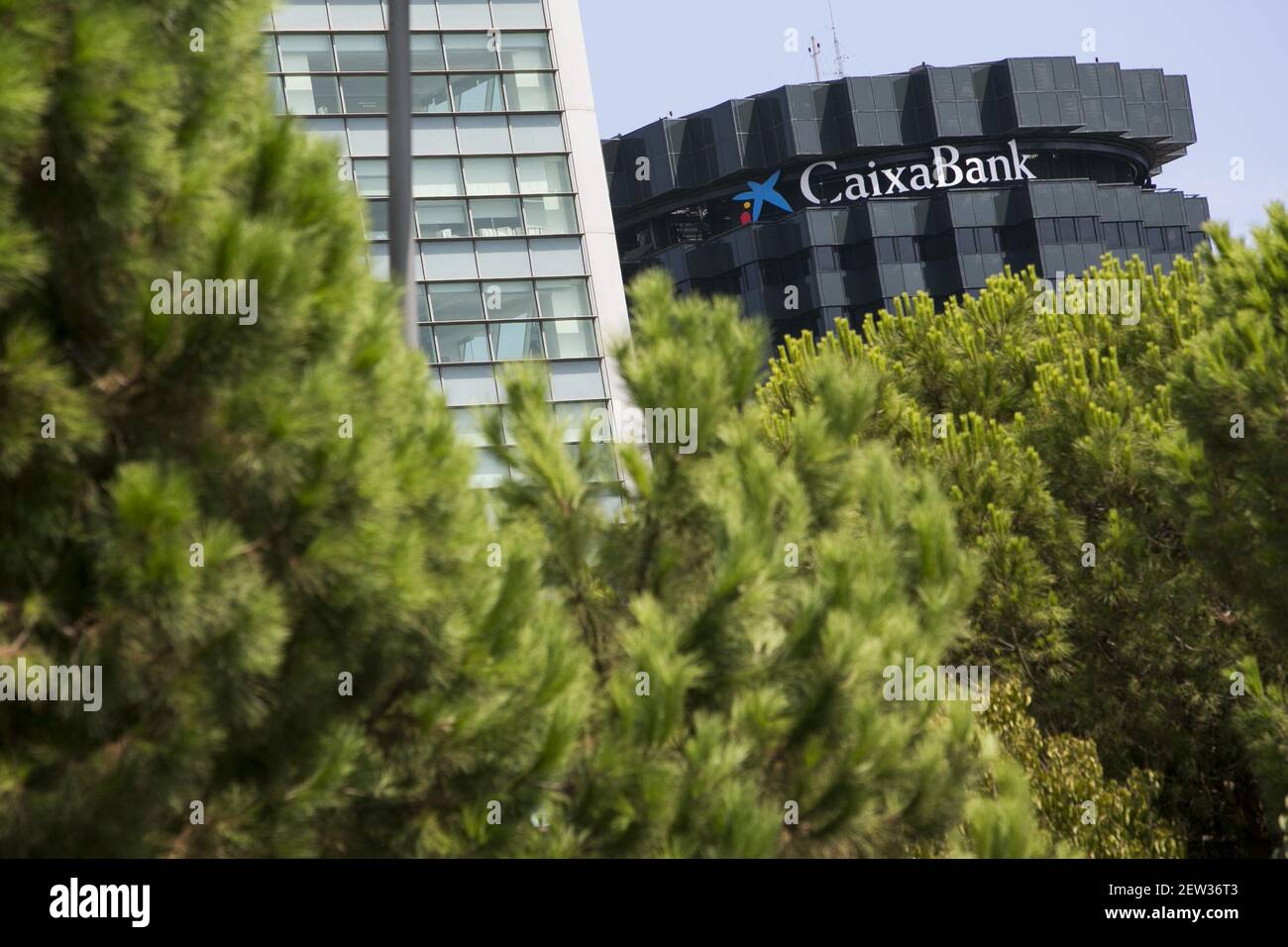 A logo sign outside of the headquarters of the La Caixa group and Caixa ...