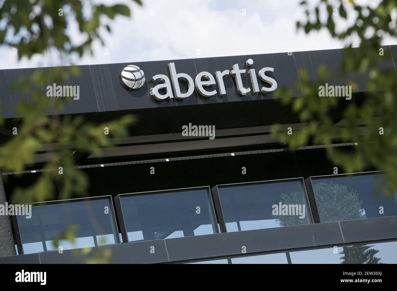 A logo sign outside of the headquarters of Abertis Infraestructuras in ...