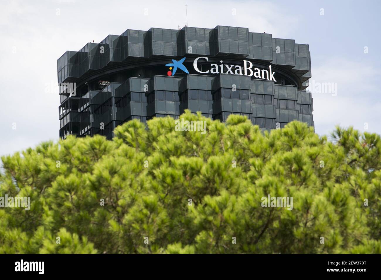 A logo sign outside of the headquarters of the La Caixa group and Caixa ...