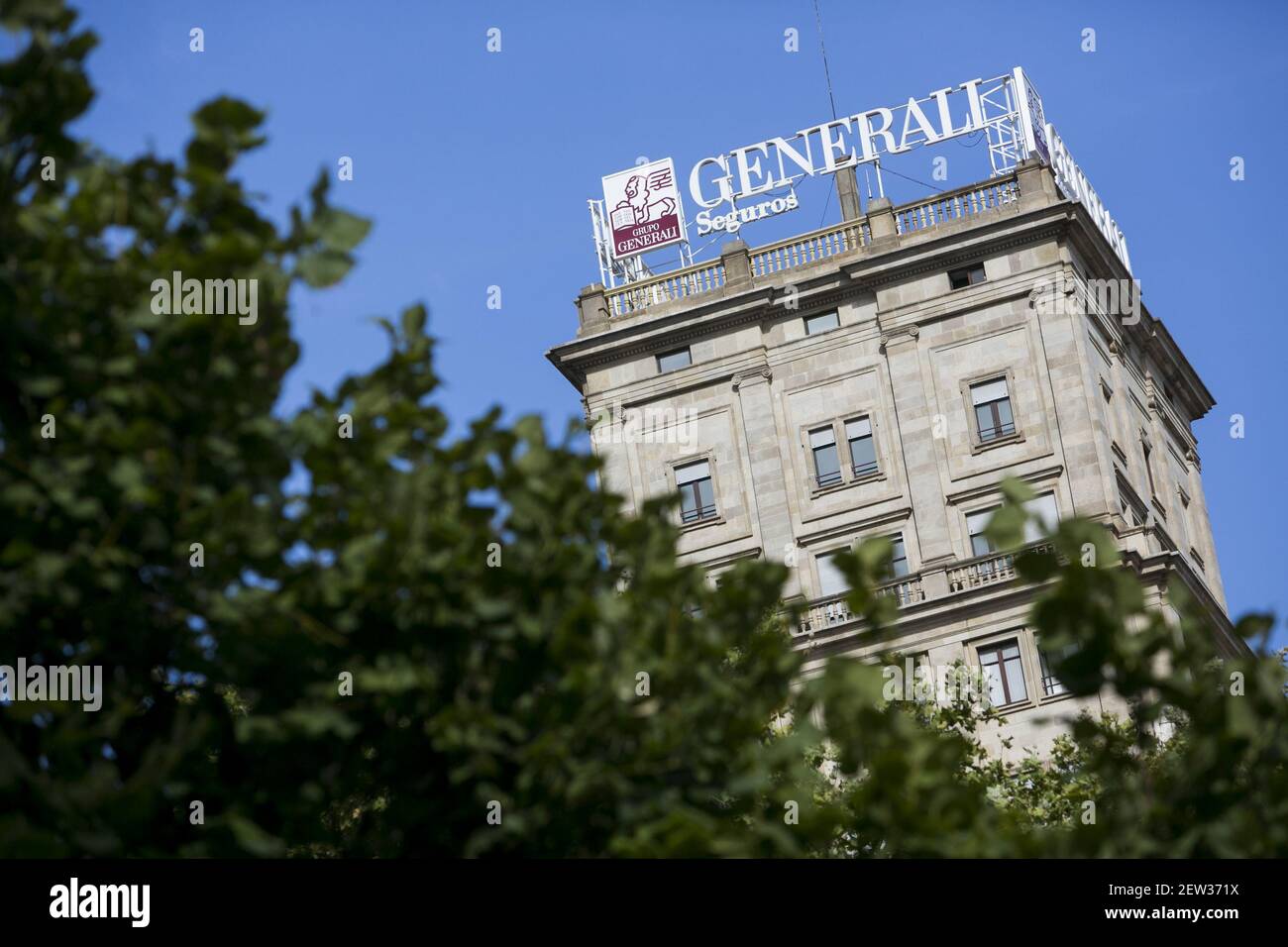 A logo sign outside of a facility occupied by the Generali Group in ...