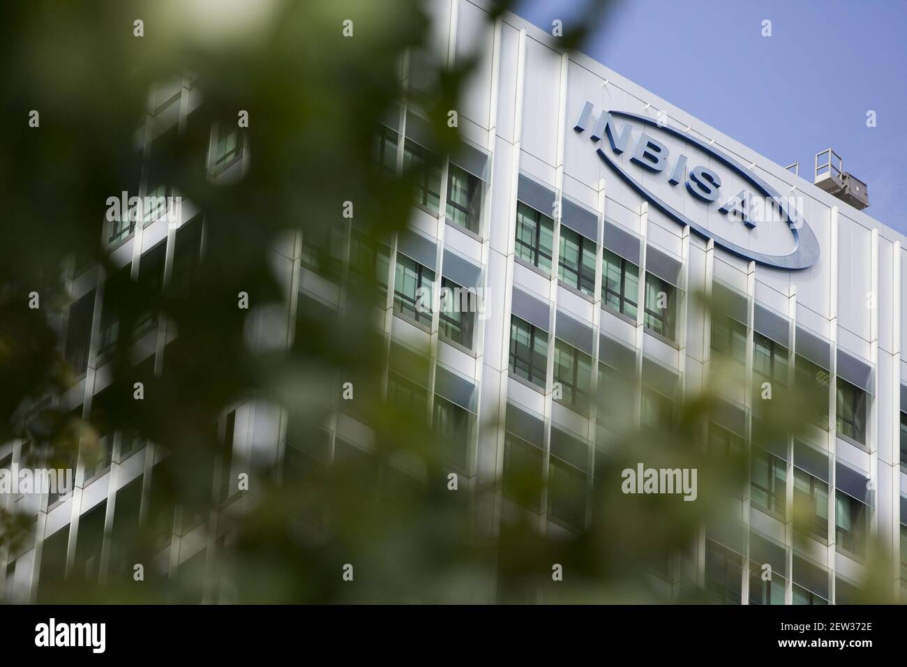A logo sign outside of the headquarters of INBISA Construccion in ...
