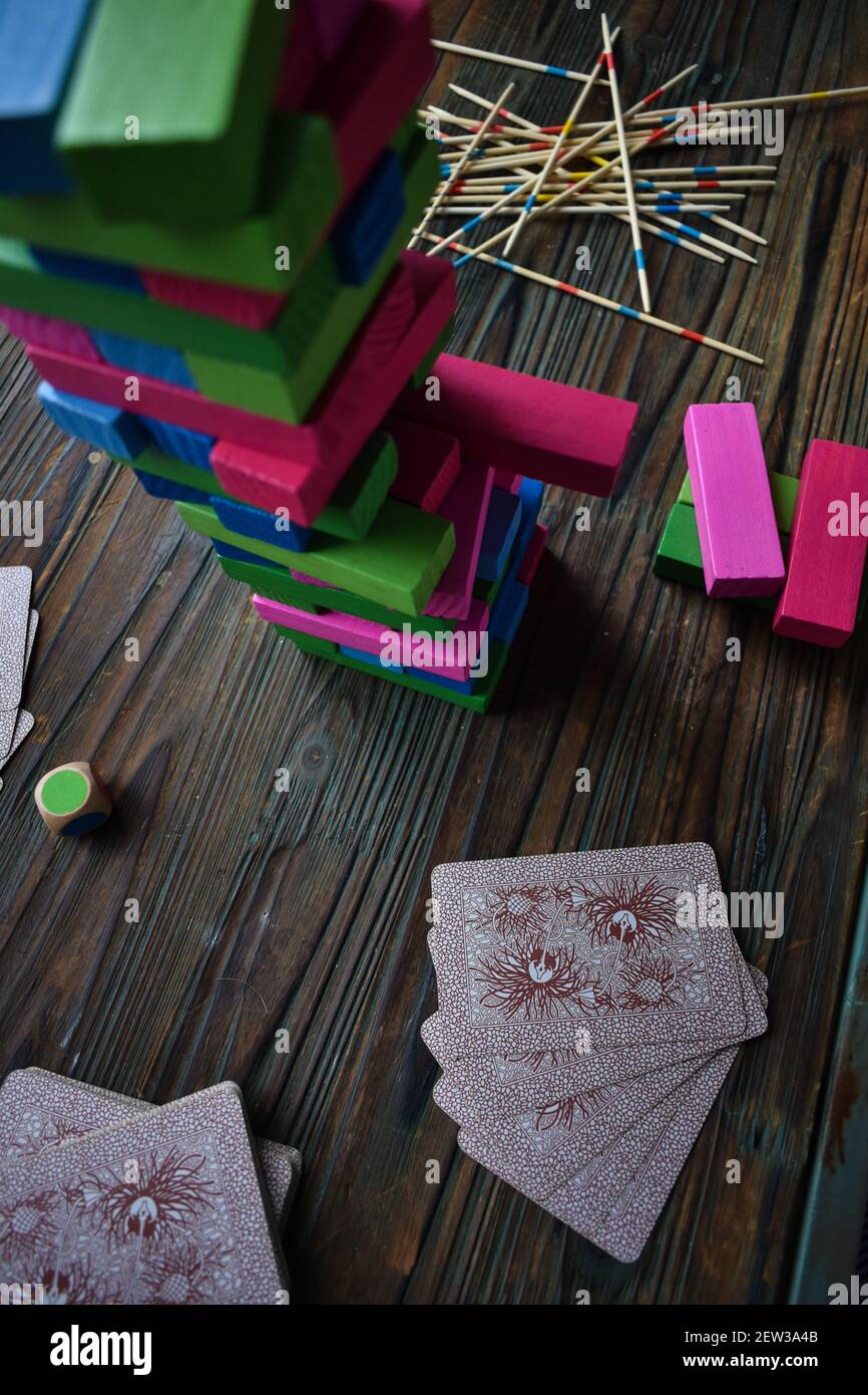 A top view of colorful Jenga game blocks stacked on each other, playing ...