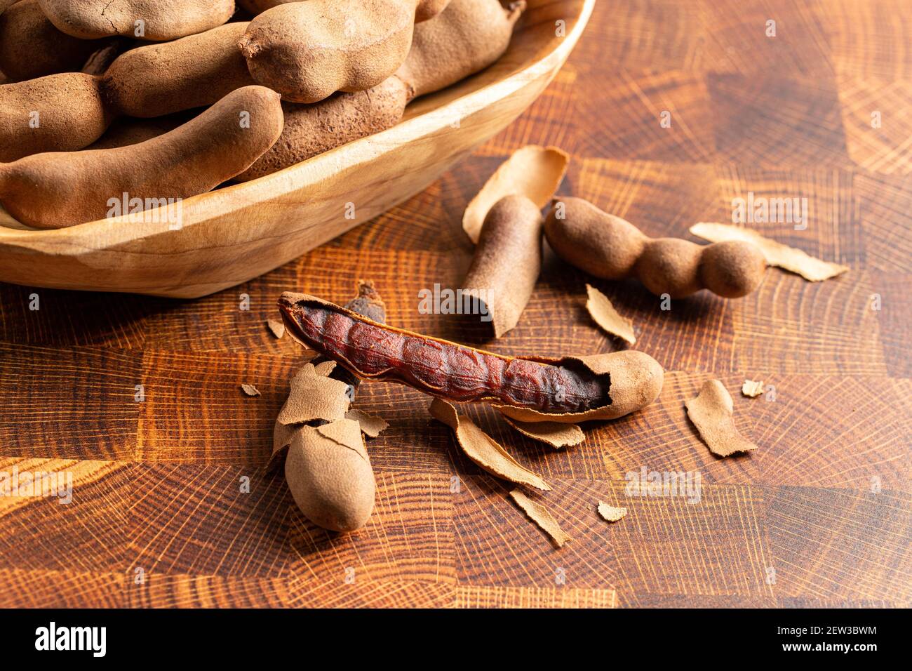 Tamarind Beans in Shell on a Brown Butchers Block Stock Photo - Alamy