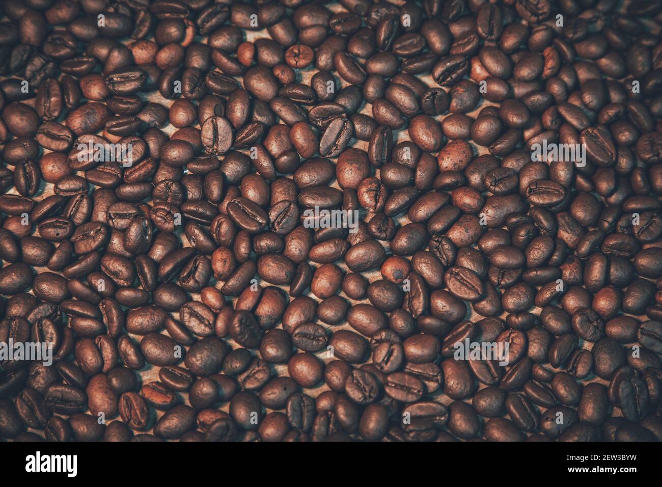Coffee beans placed on old wooden boards with free space for ...