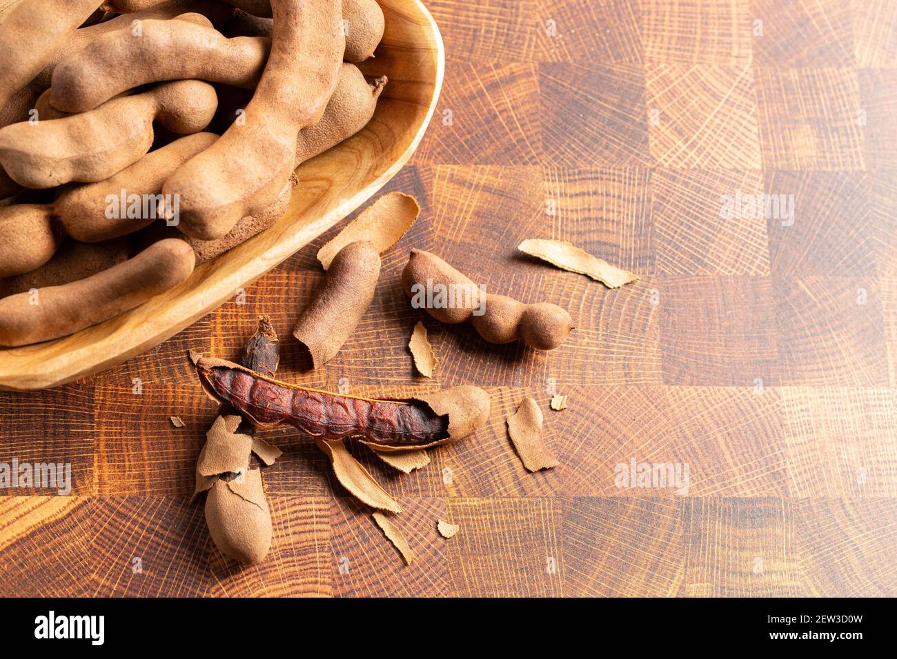 Tamarind Beans in Shell on a Brown Butchers Block Stock Photo - Alamy
