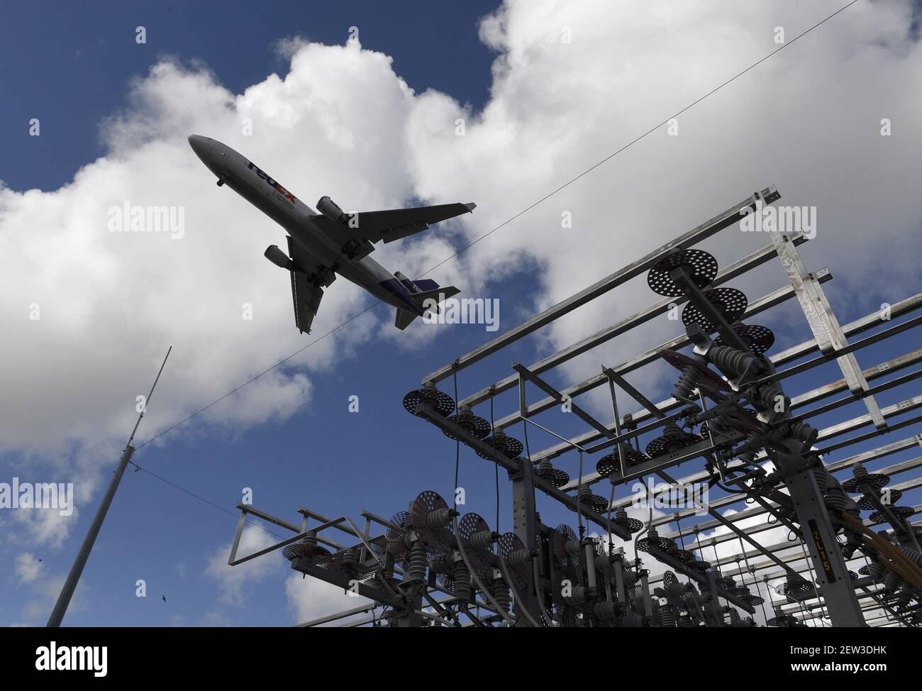 A plane flies over the FPL Collins Substation in Fort Lauderdale, Fla ...