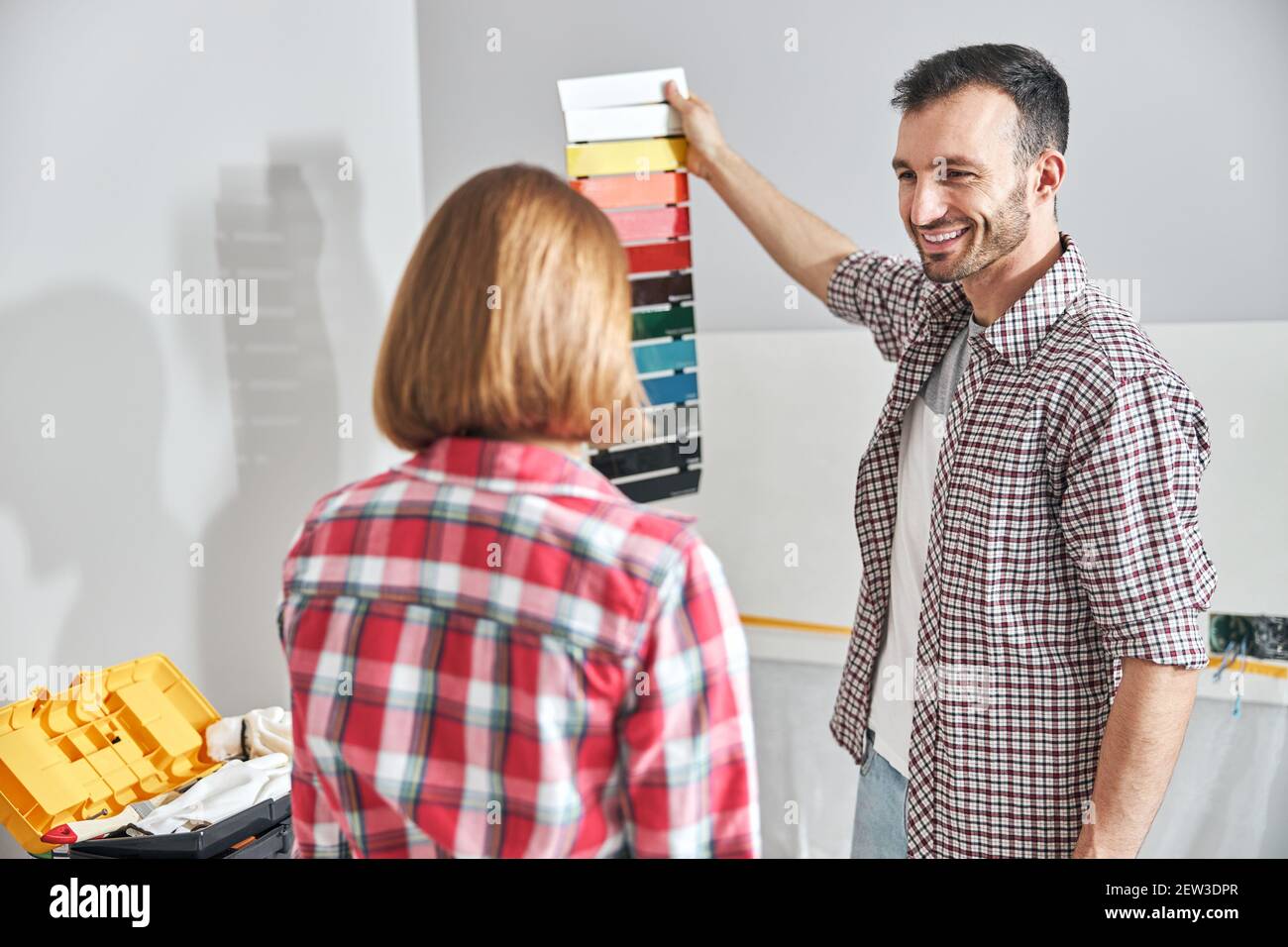 Flat owner and a workman selecting the right color palette Stock Photo ...