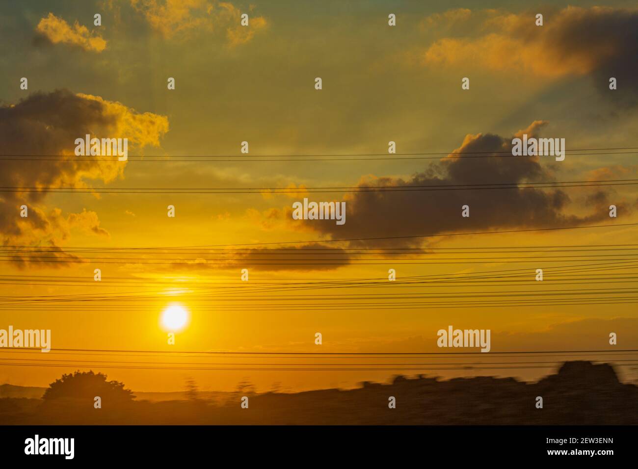 Golden and colorful sunset with orange yellow blue and green colors ...