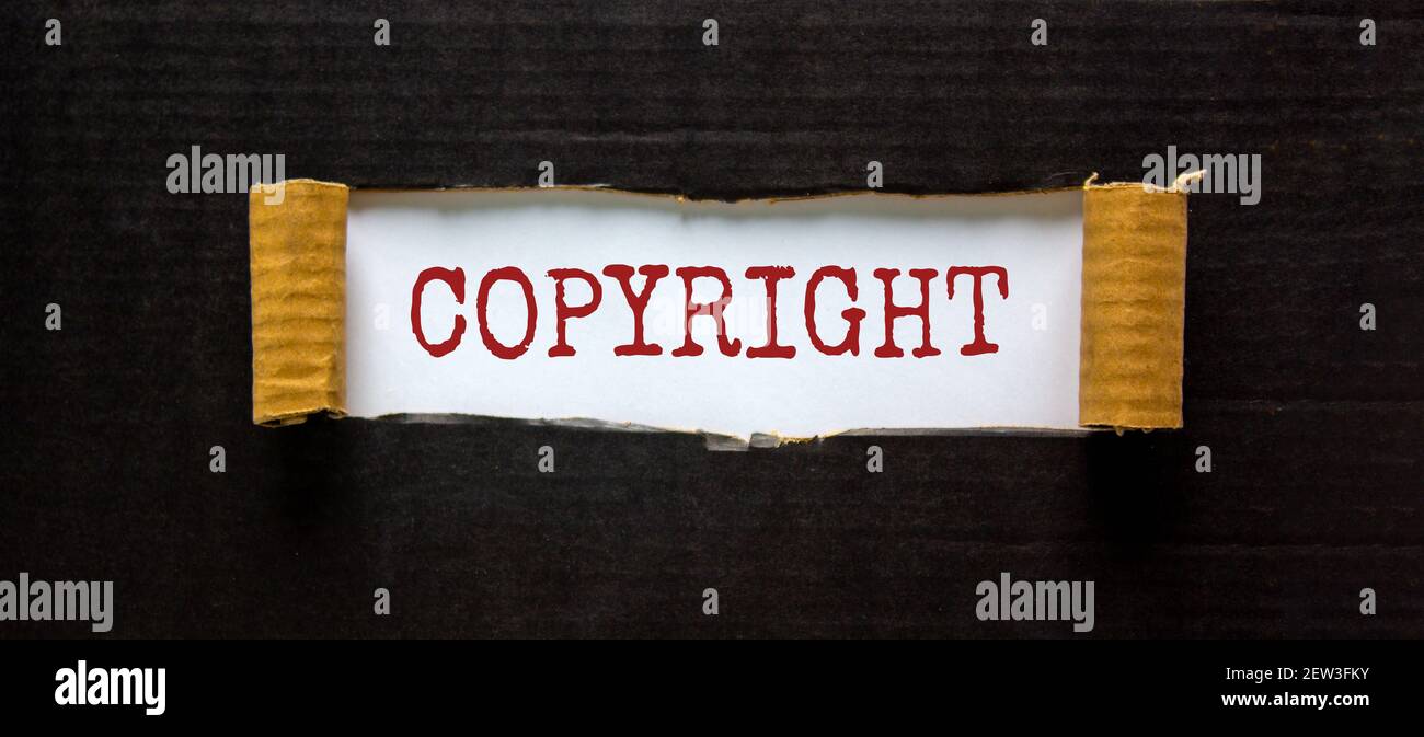 Copyright symbol. The word 'Copyright' appearing behind torn black ...