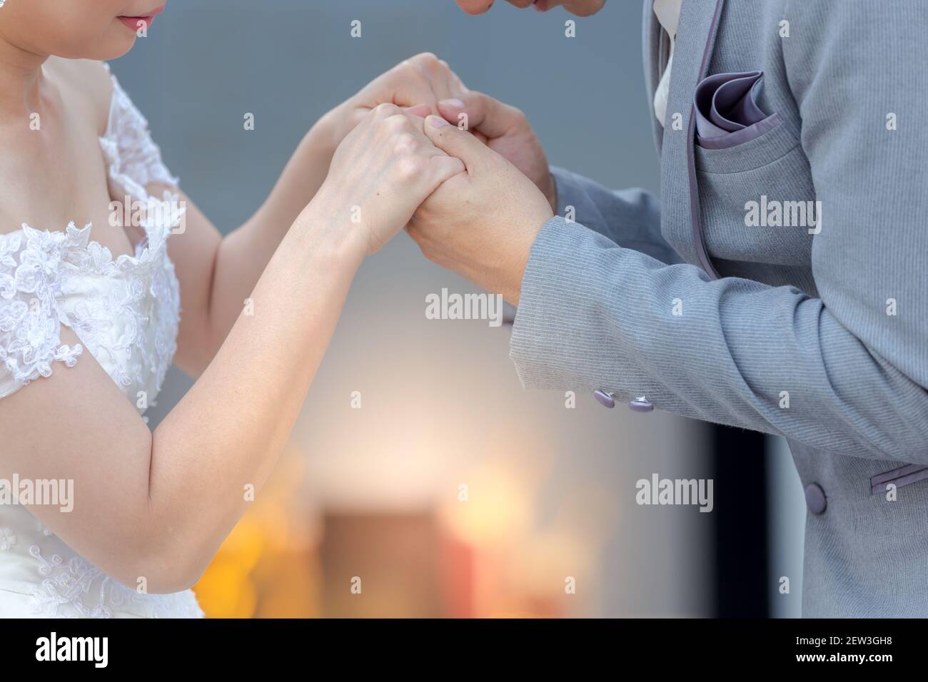 Bride and bridegroom married hands when sun is falling. background.Soft ...