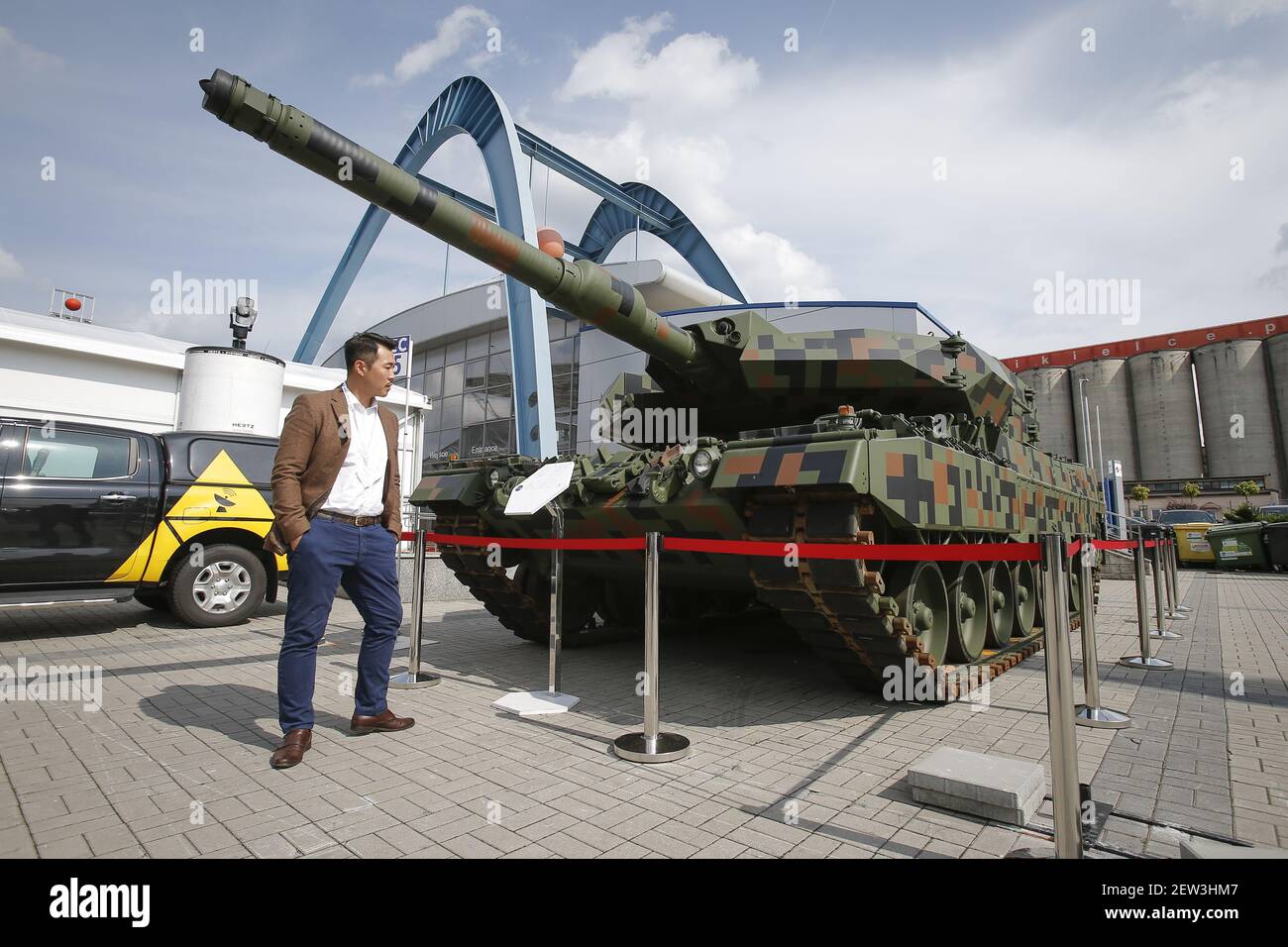 A man views a German made Leopard tank painted in digital camouflage ...