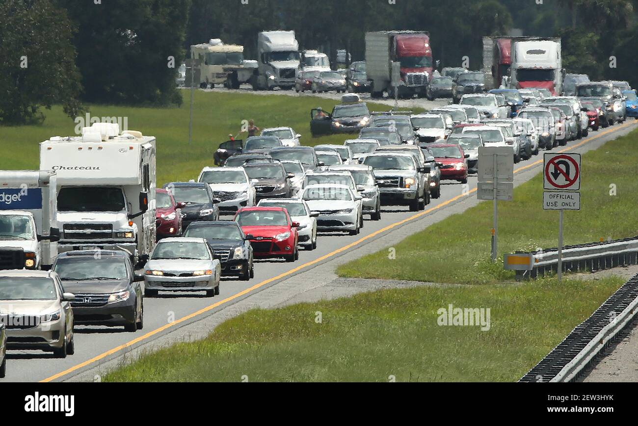 Traffic rolls at a crawl on the northbound lanes of Florida's Turnpike ...