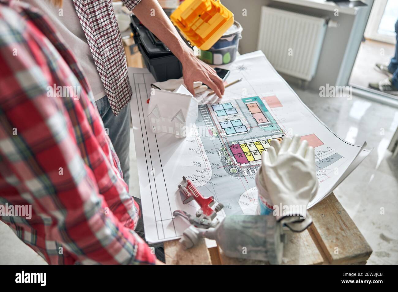 Professional interior designers working at a building project Stock ...