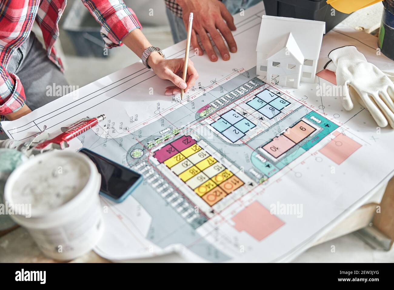 Two building designers working at a technical drawing Stock Photo - Alamy
