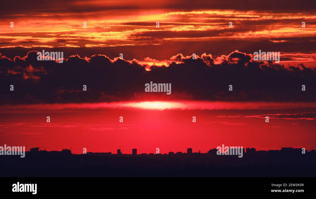Red sunset over silhouettes of city buildings, top view Stock Photo - Alamy