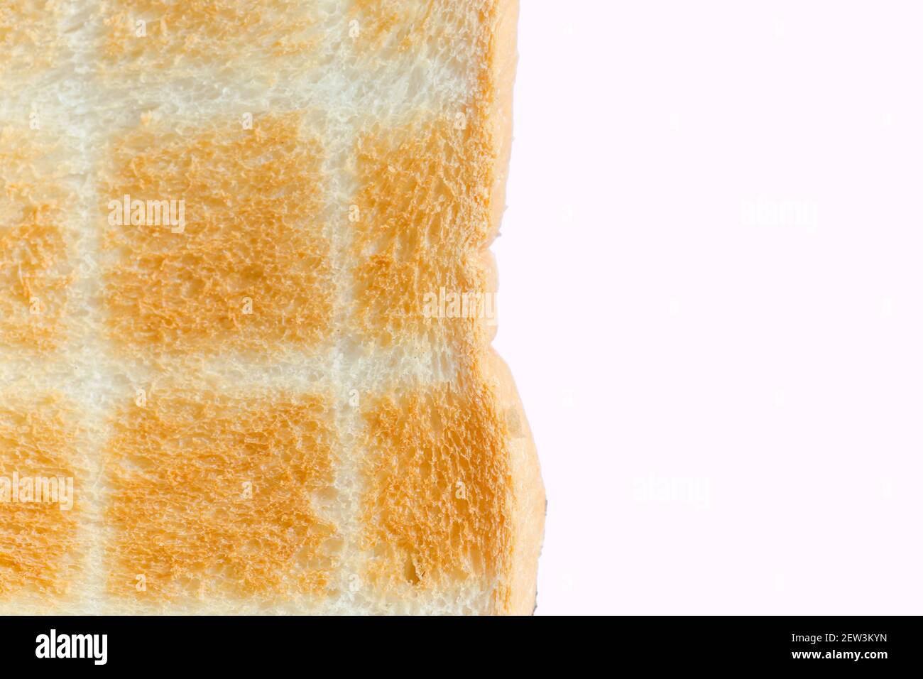 The texture and detail of the white toasted bread is the golden yellow ...