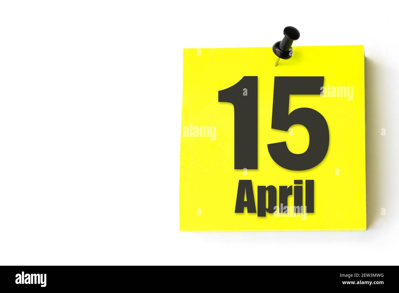 April 15th. Day 15 of month, Calendar date. Yellow sheet of the ...