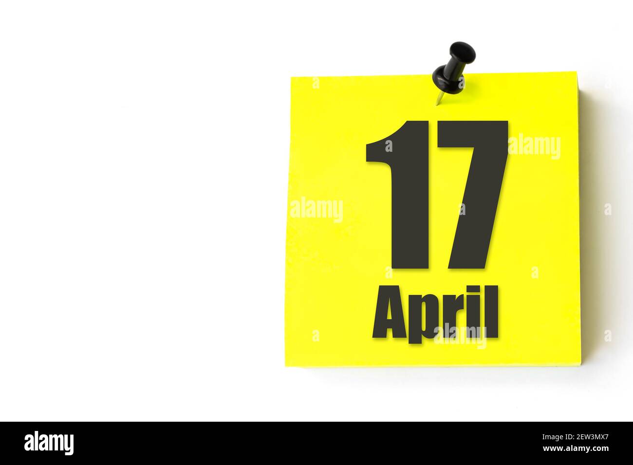 April 17th. Day 17 of month, Calendar date. Yellow sheet of the ...