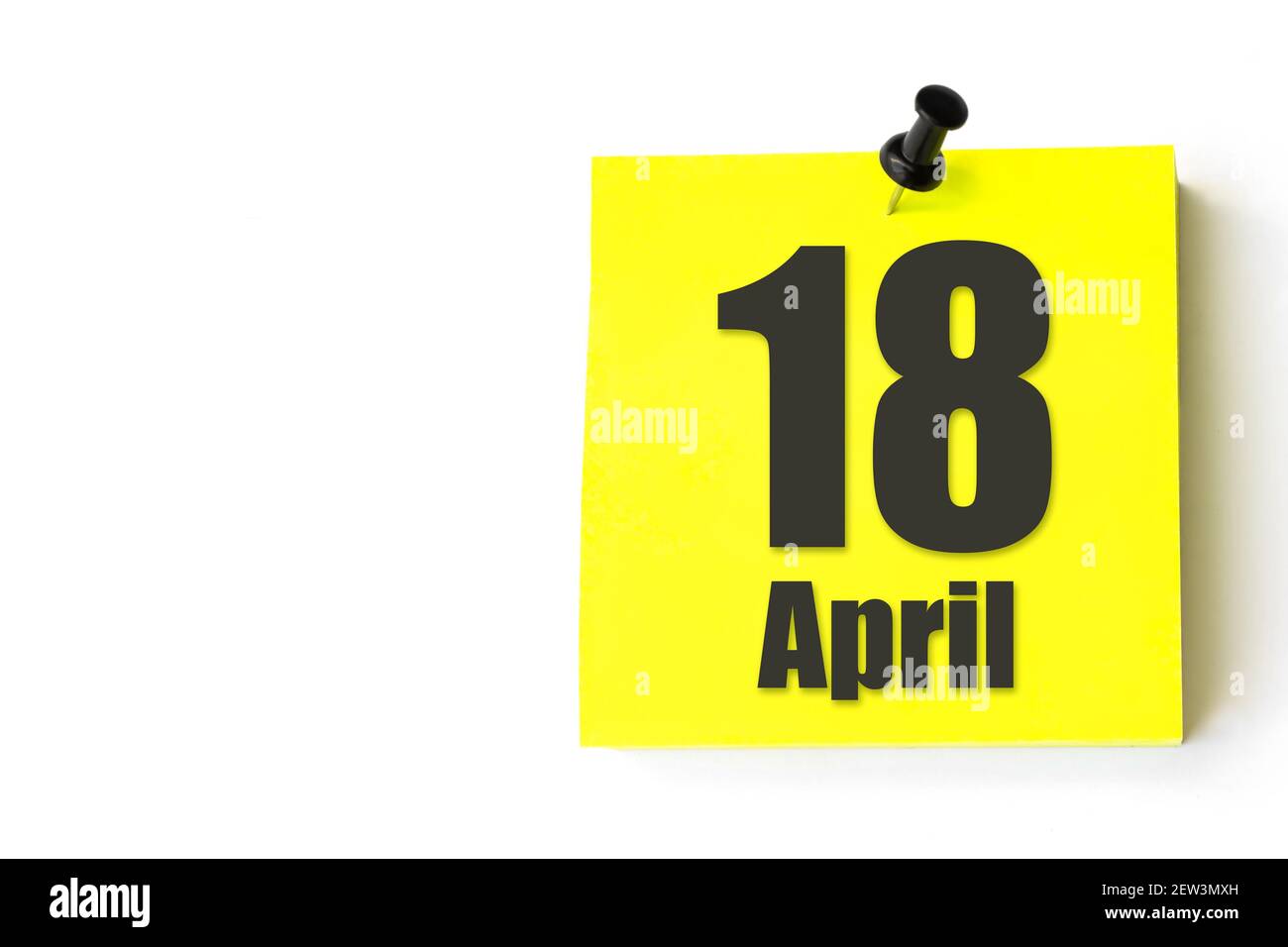 April 18th. Day 18 of month, Calendar date. Yellow sheet of the ...
