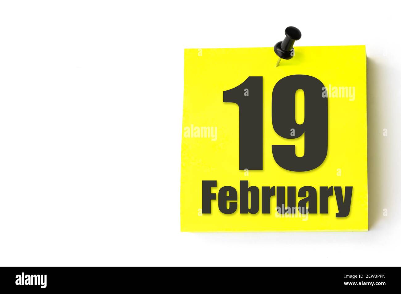 February 19th. Day 19 of month, Calendar date. Yellow sheet of the ...
