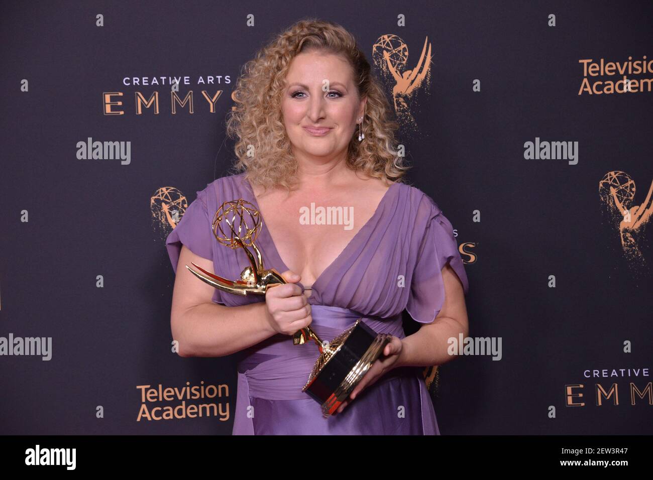 Choreographer Mandy Moore poses in the press room with the award for ...
