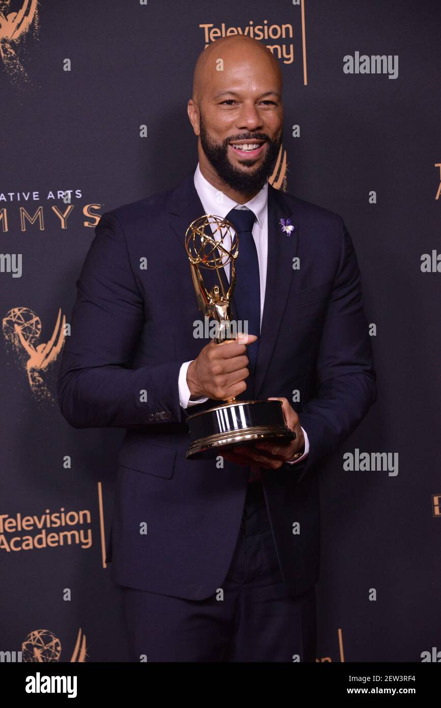 Hip-hop artist Common poses in the press room with the award for ...