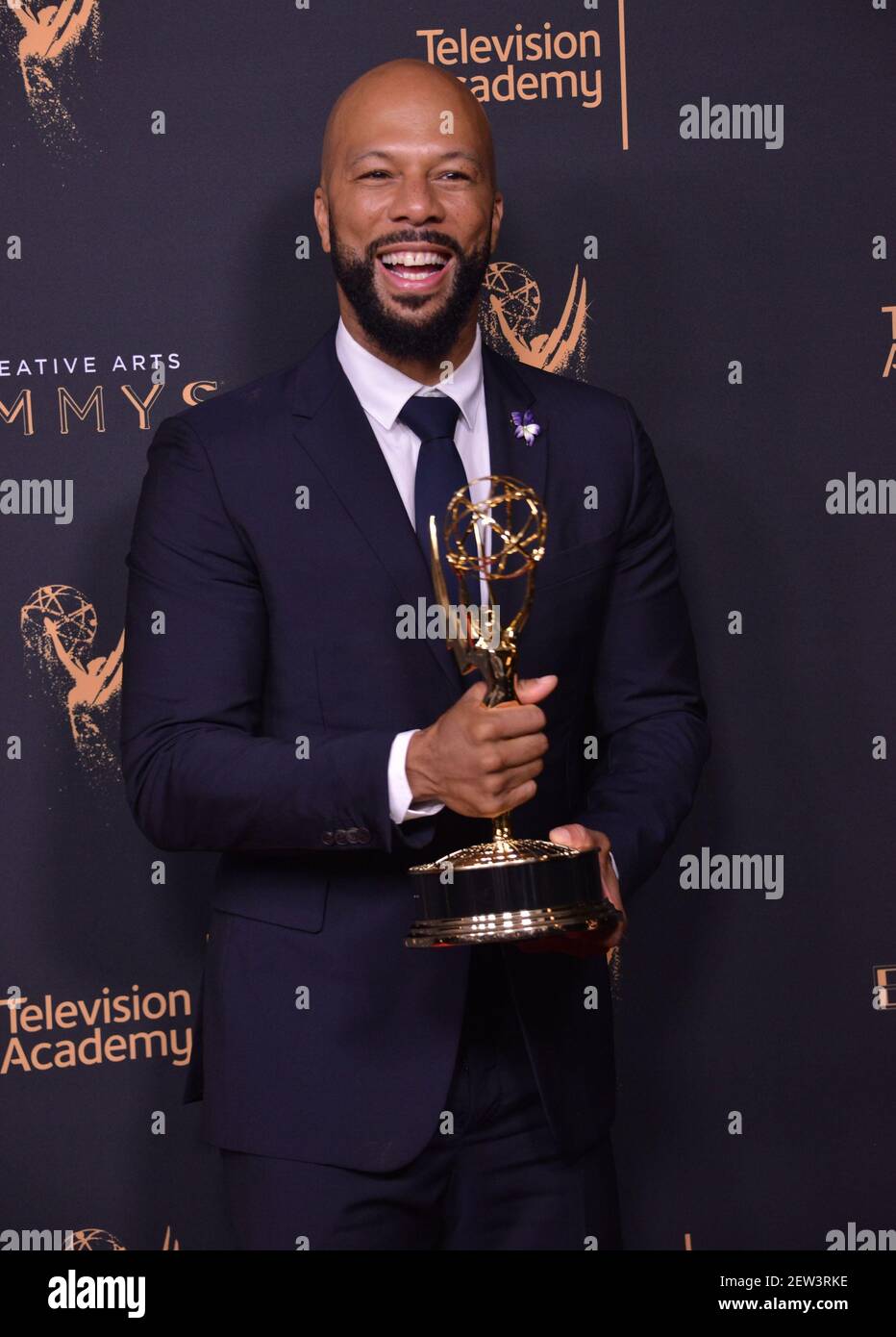 Hip-hop artist Common poses in the press room with the award for ...
