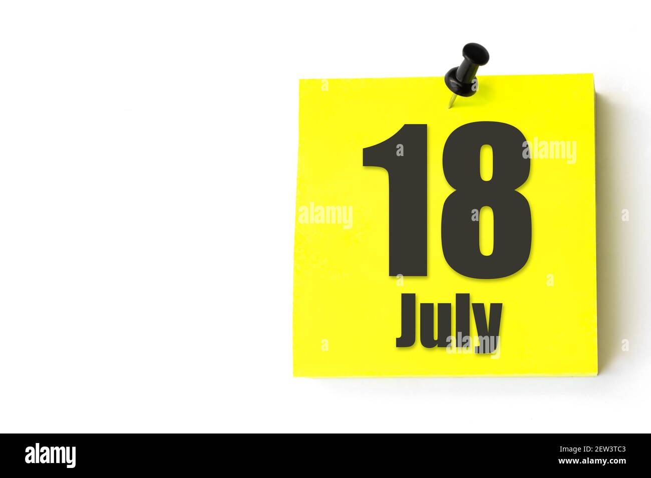 July 18th. Day 18 of month, Calendar date. Yellow sheet of the calendar ...