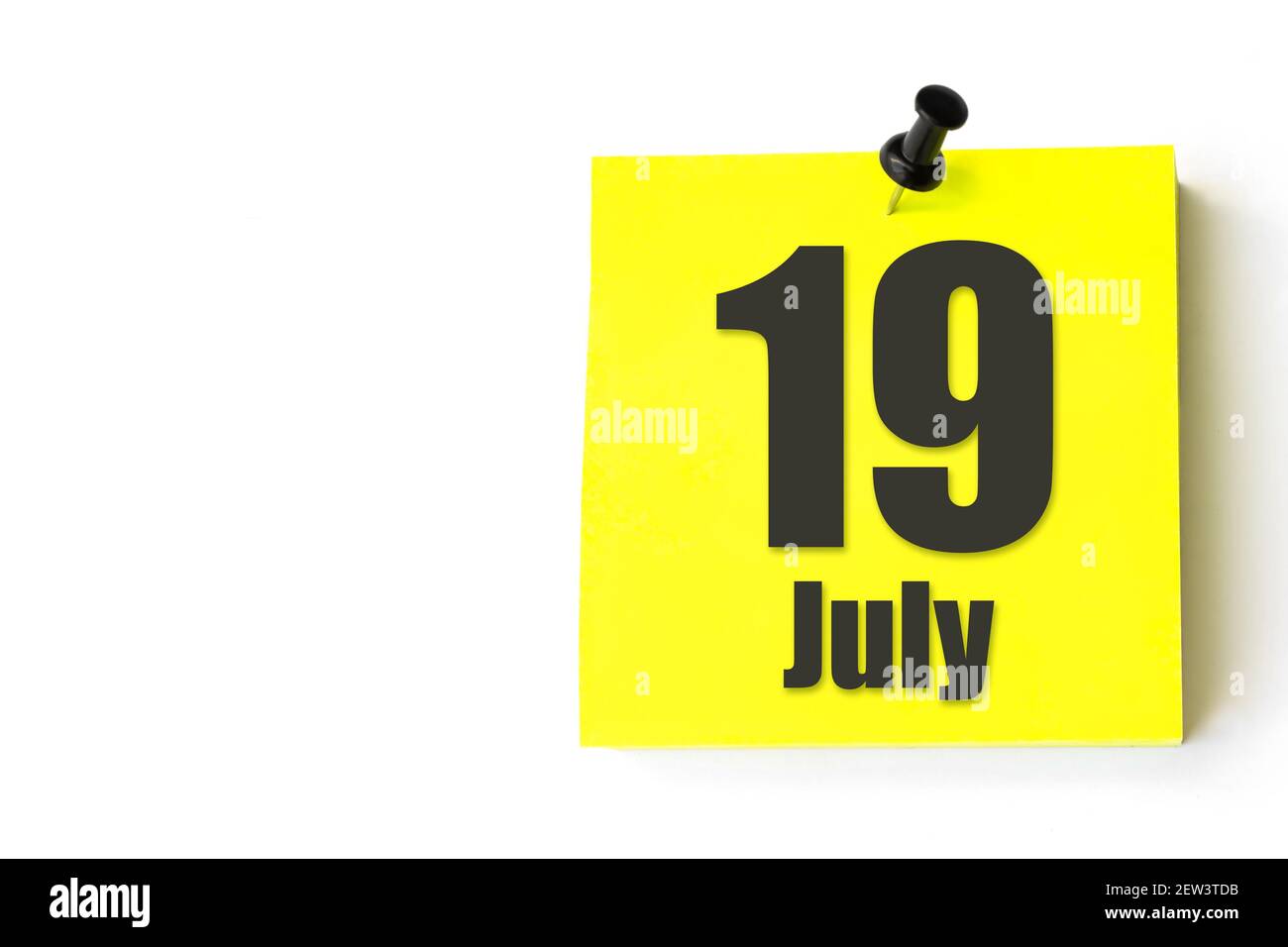 July 19th. Day 19 of month, Calendar date. Yellow sheet of the calendar ...
