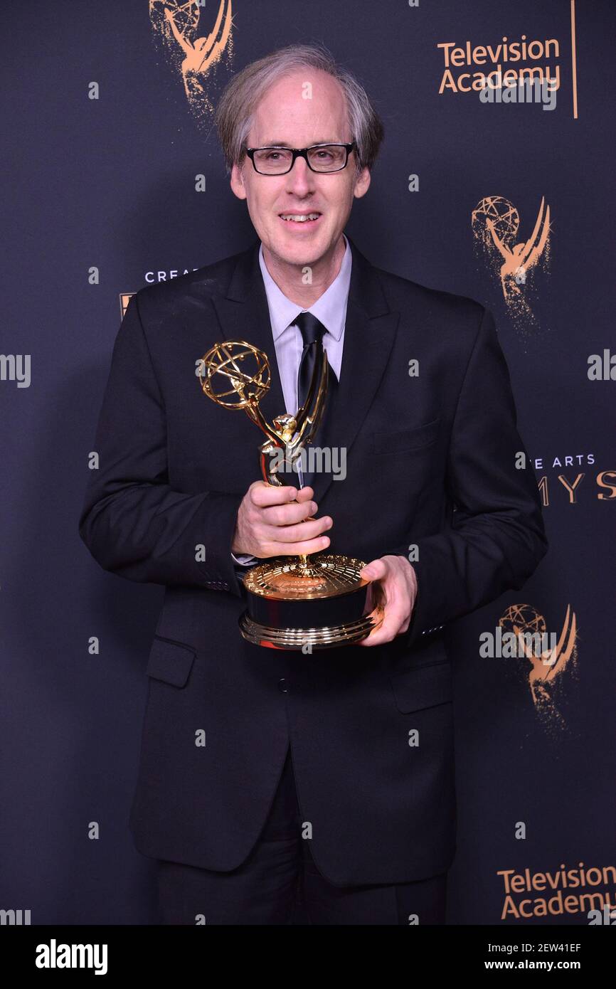 Jeff Beal poses in the press room with the award for outstanding music ...