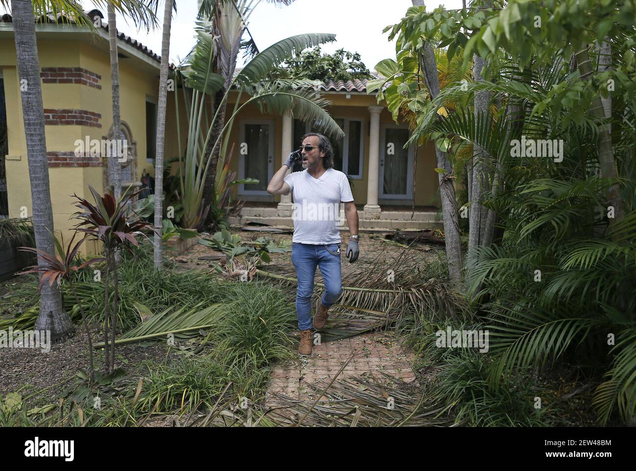 Homeowner Richard Todaro, owner of a home in the Bayshore, cleans ...