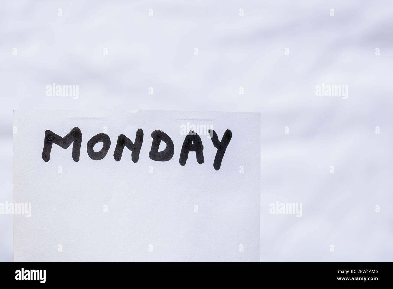 Monday handwriting text close up isolated on white paper with copy ...