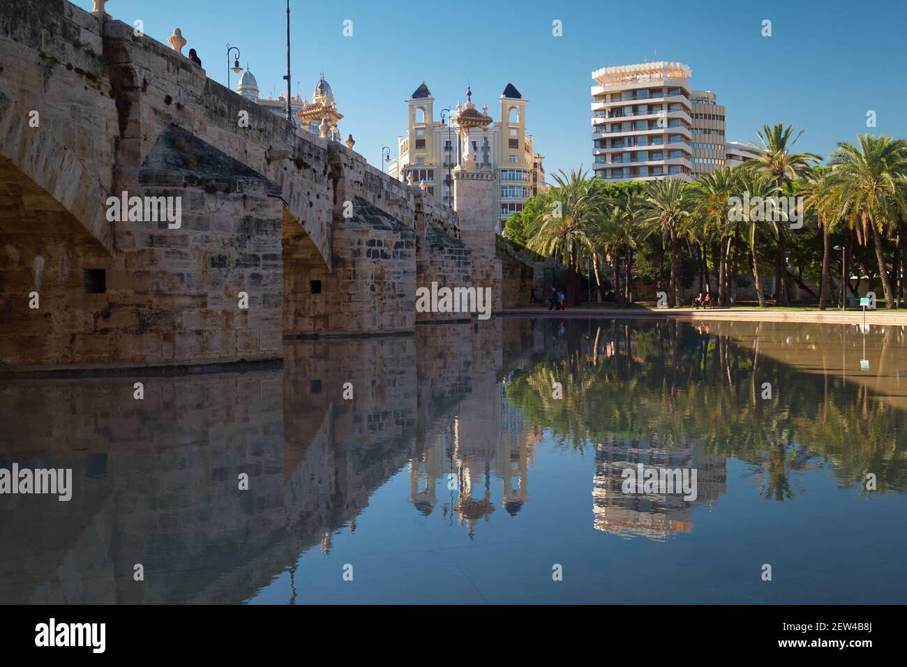 Pedestrian cobblestone bridge Pont del Mar or Sea Bridge reflected in ...