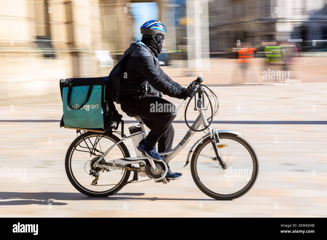 Fast food delivery cyclist in a city centre, UK Stock Photo - Alamy