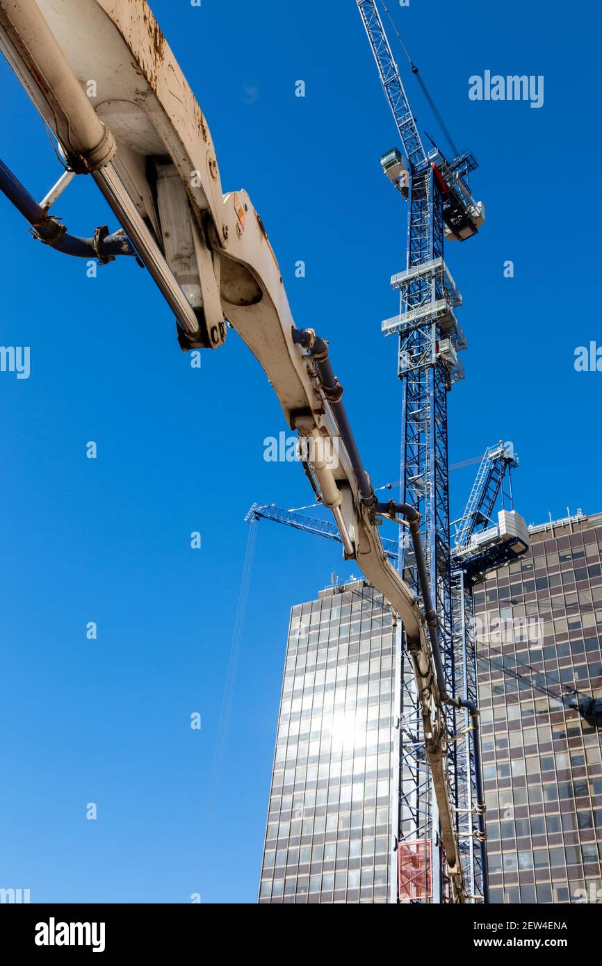 Boom arm concrete supply, building site, UK Stock Photo - Alamy