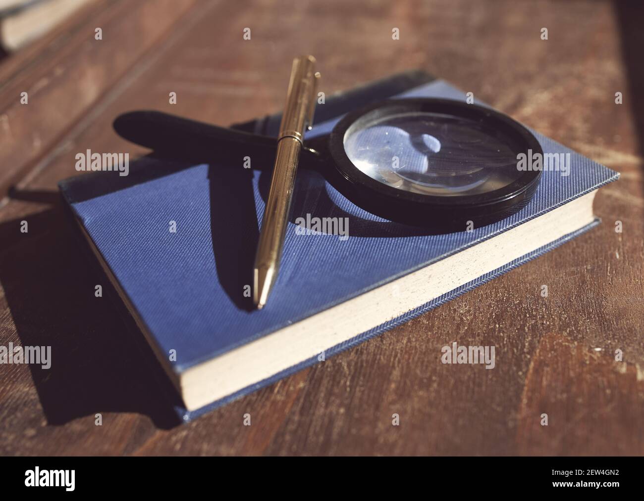 Notebook magnifying pen on work desk hi-res stock photography and ...