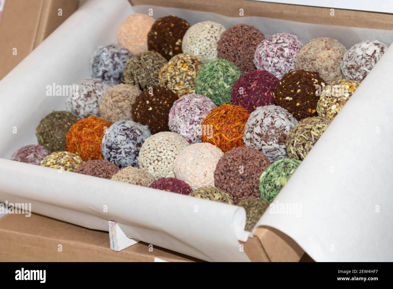 Round colorful handmade candies. Chocolate in festive packaging Stock ...