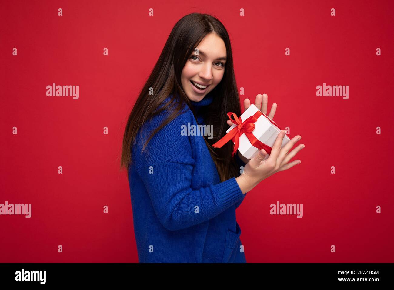 Shot of attractive positive smiling young brunette woman isolated over ...